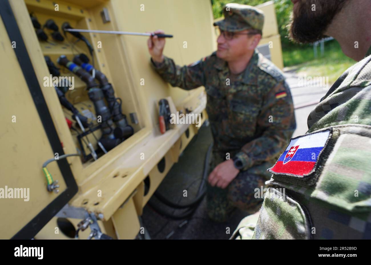 31 May 2023, Schleswig-Holstein, Todendorf: A staff sergeant (l) of Air ...