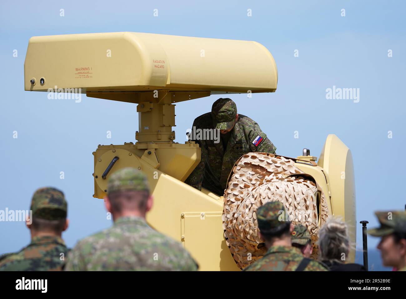31 May 2023, Schleswig-Holstein, Todendorf: A Slovakian soldier checks ...