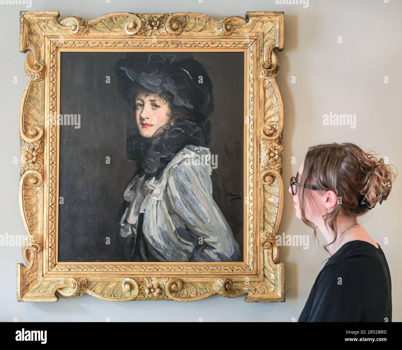 London, UK. 31st May, 2023. Gallery staff with Sir John Lavery ...