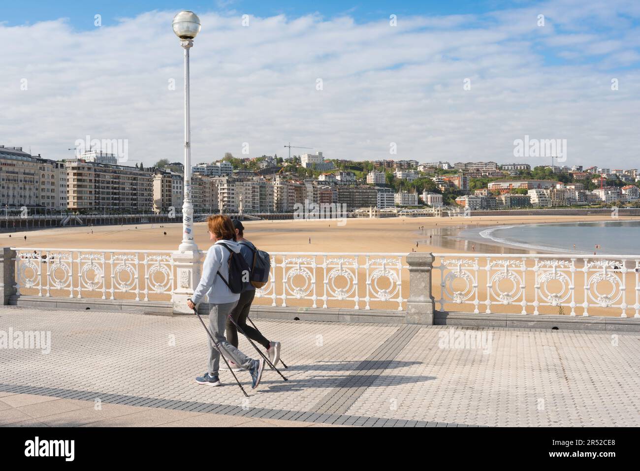 Women walking, view of two female friends walking together on a ...