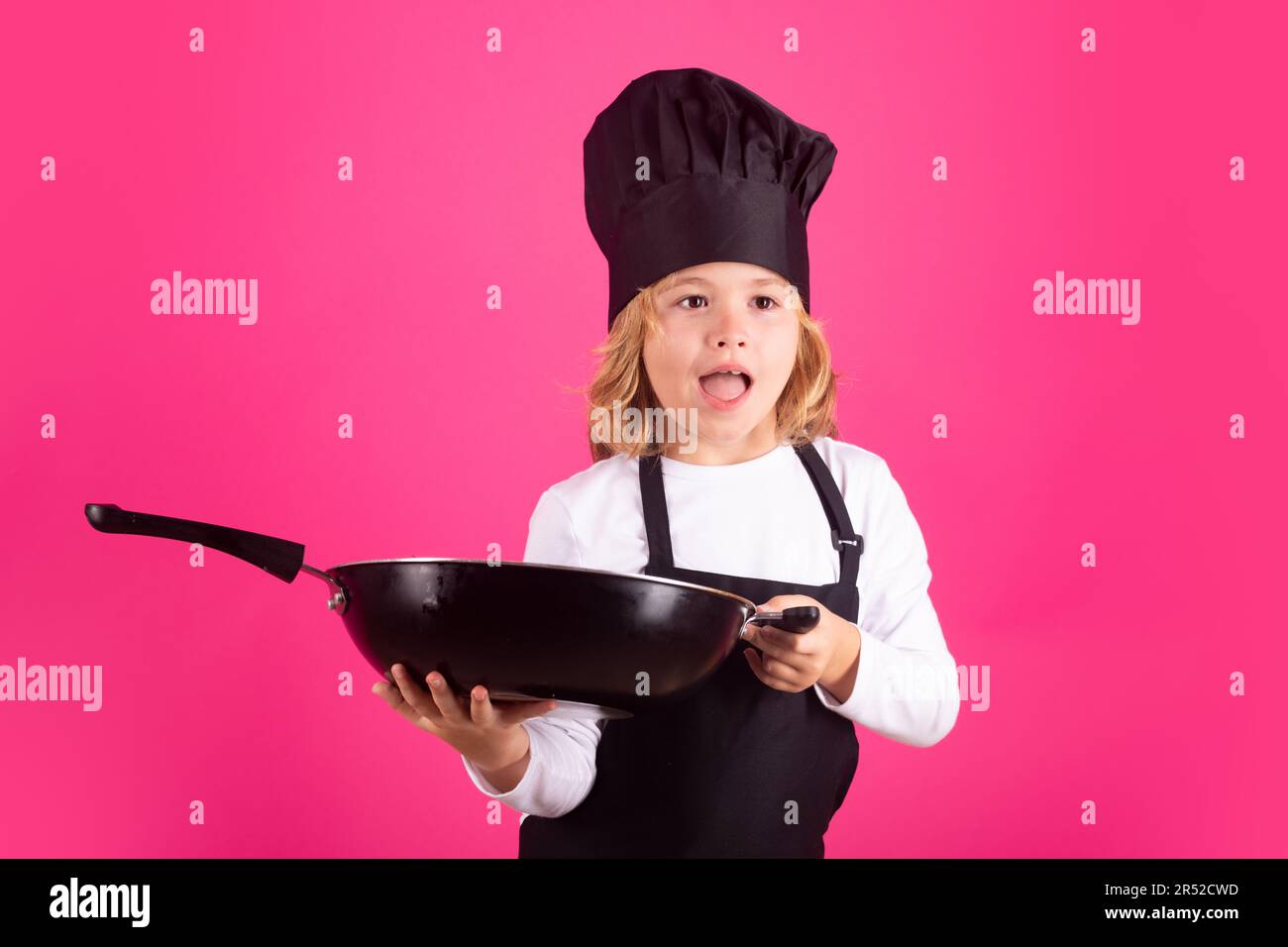 Child chef cook with pan. Kid in cooker uniform and chef hat preparing ...