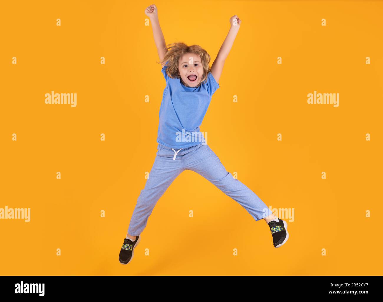 Full length of excited kid jumping. Full length body size of carefree ...