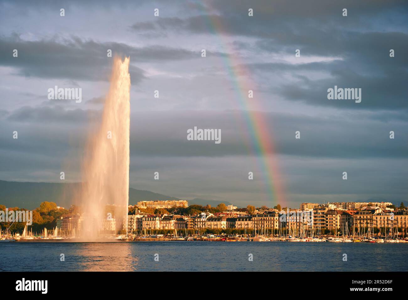 City landscape of Geneva downtown and lake, Switzerland, bright rainbow ...