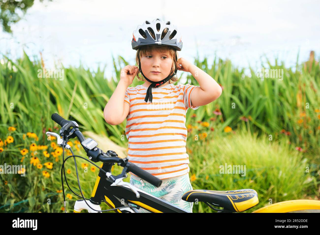 Cute little boy riding bicycle in the park, sport for children, active ...