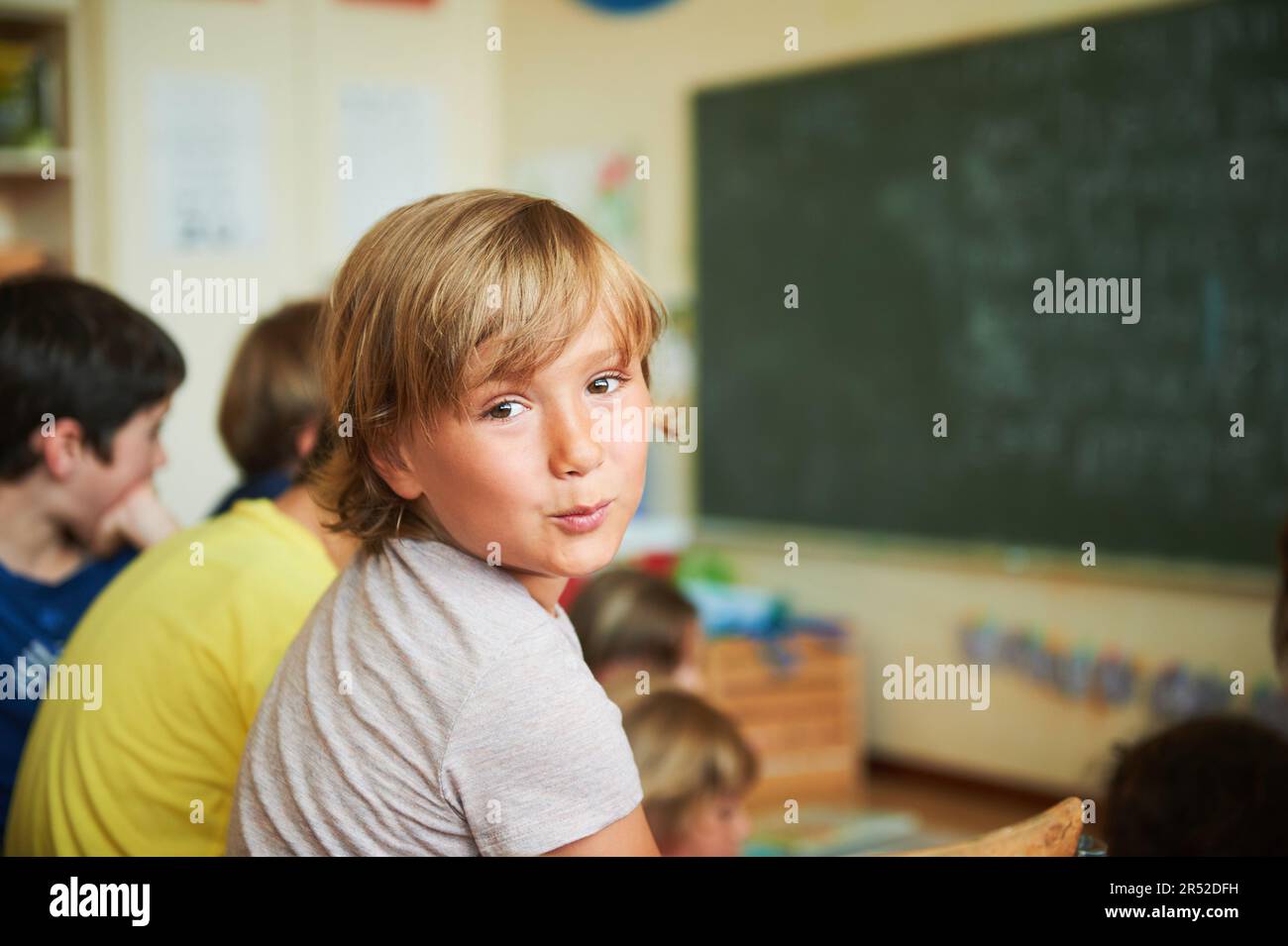 Cute little boy working in classroom, education, back to school concept ...