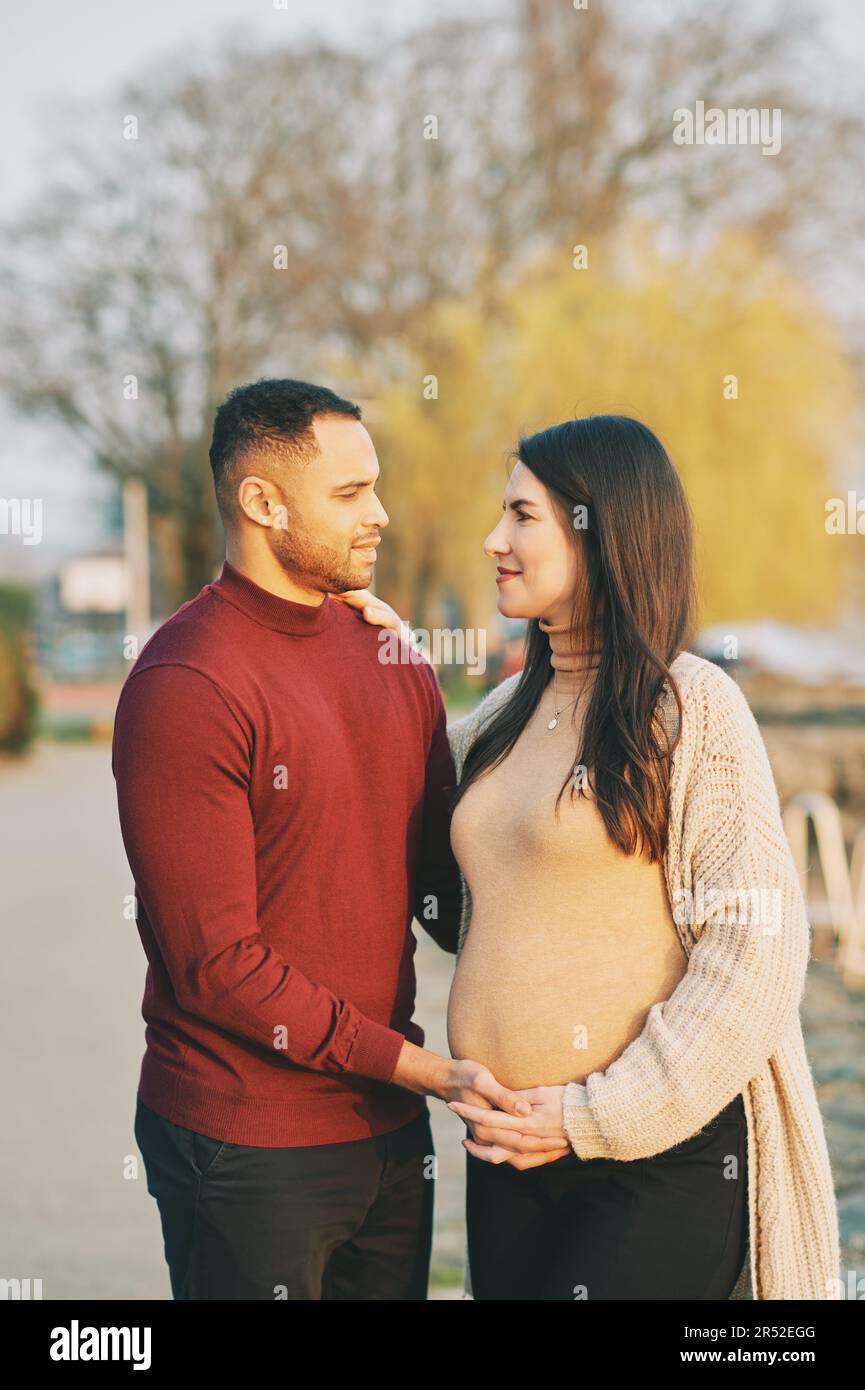 Outdoor portrait of beautiful pregnant couple, early spring image Stock ...