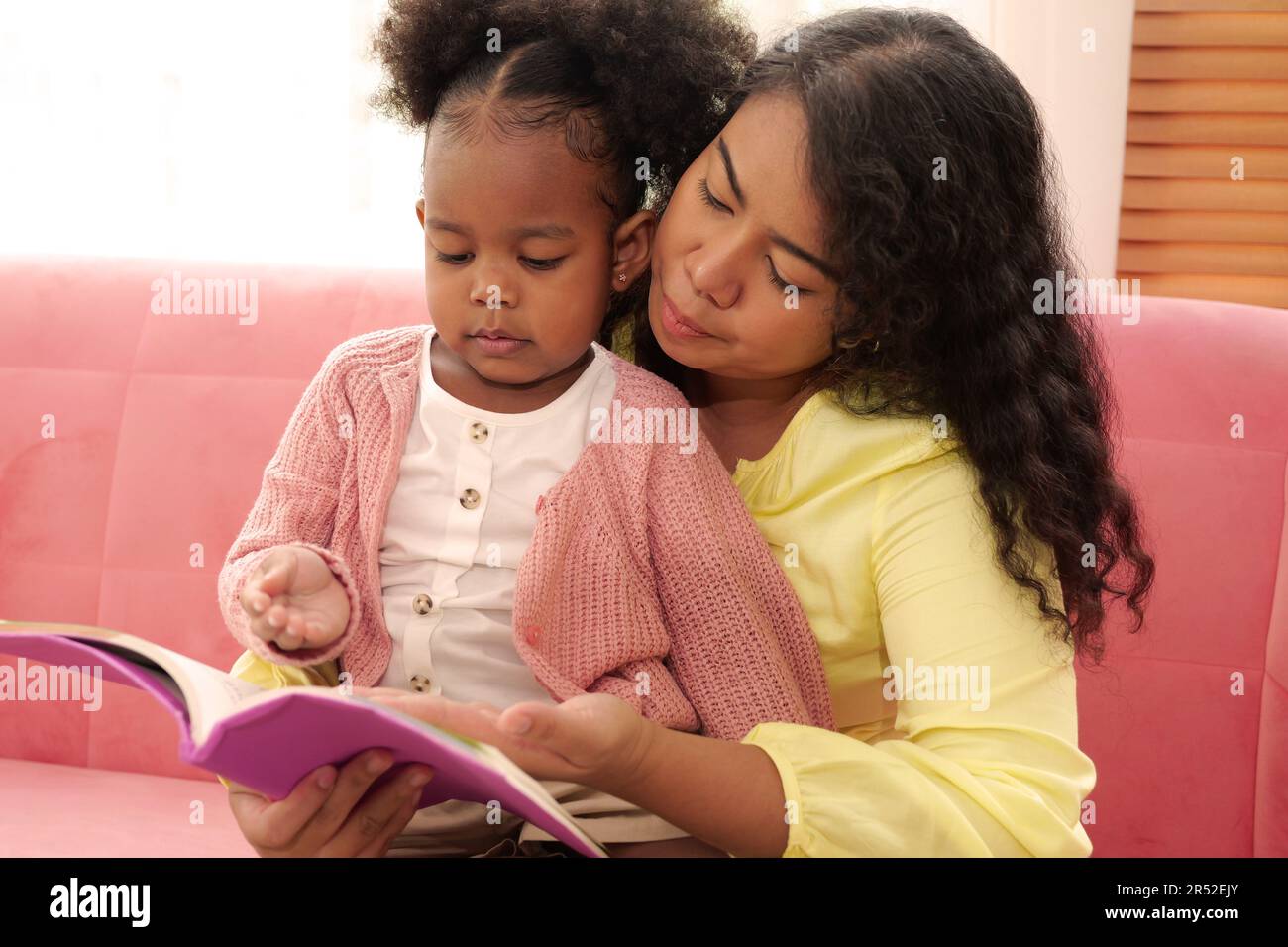 Parent and child having fun with activities and playing at home Stock ...