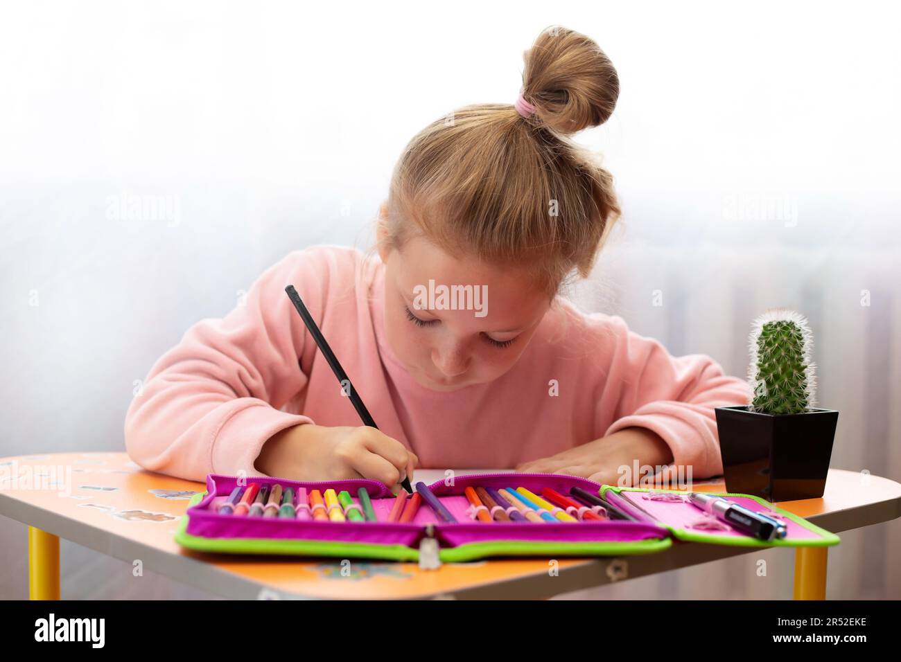 Child doing homework writing hi-res stock photography and images - Alamy
