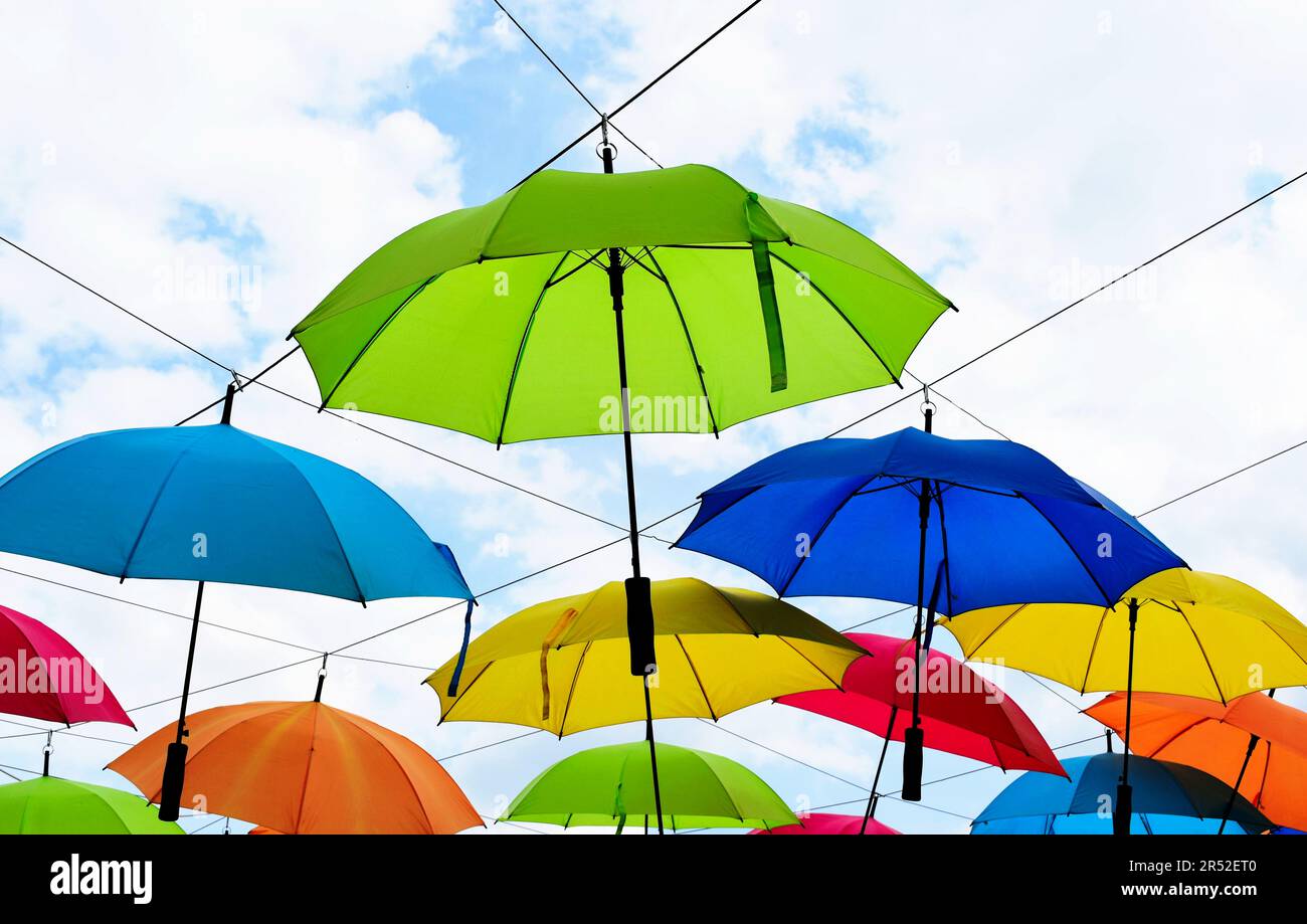 colorful parasol sun protection. bright umbrellas suspended overhead on ...