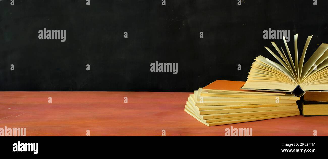 education, knowledge, reading, business concept, open book and stack of ...