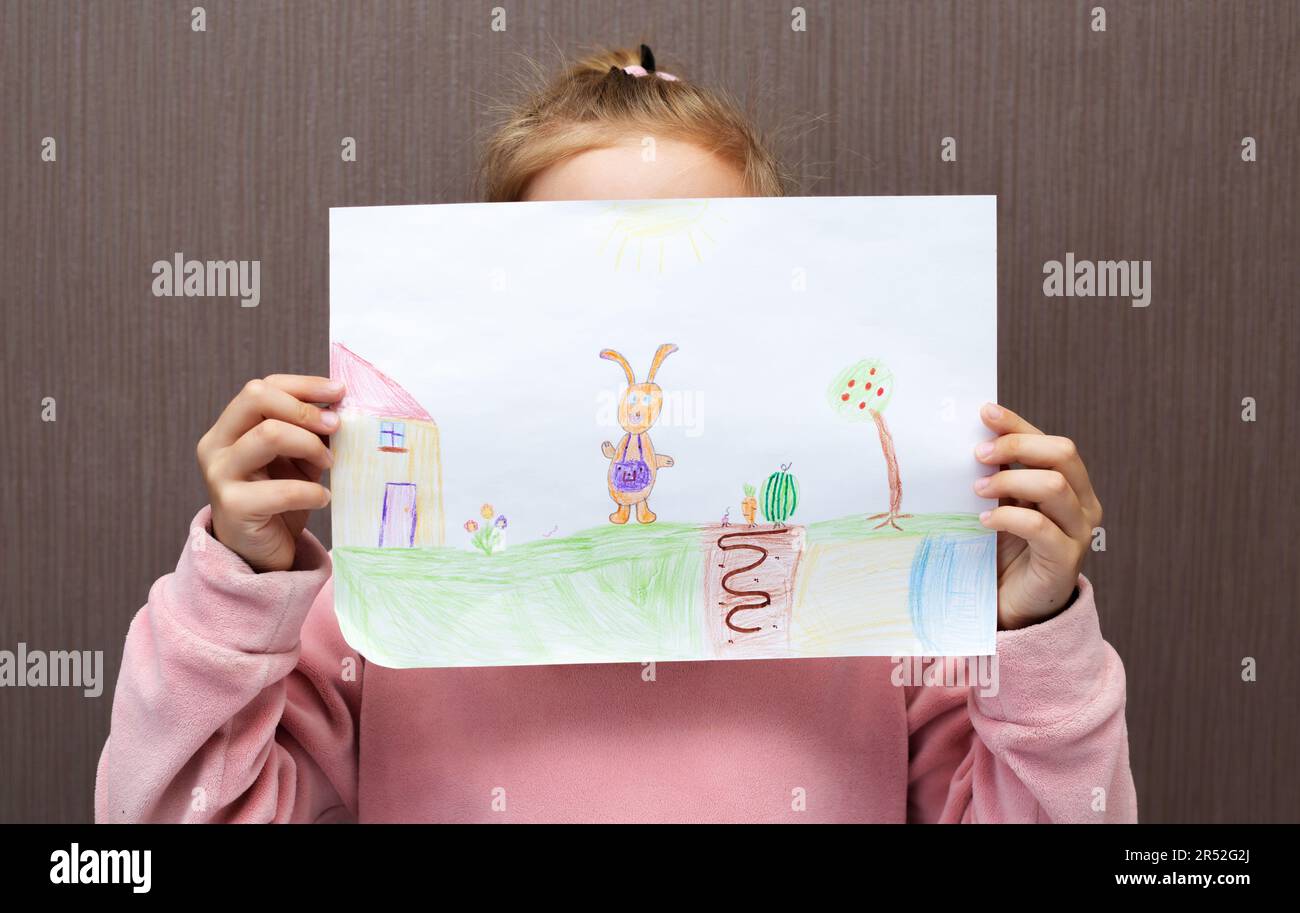 kid Girl shows his drawing Stock Photo - Alamy