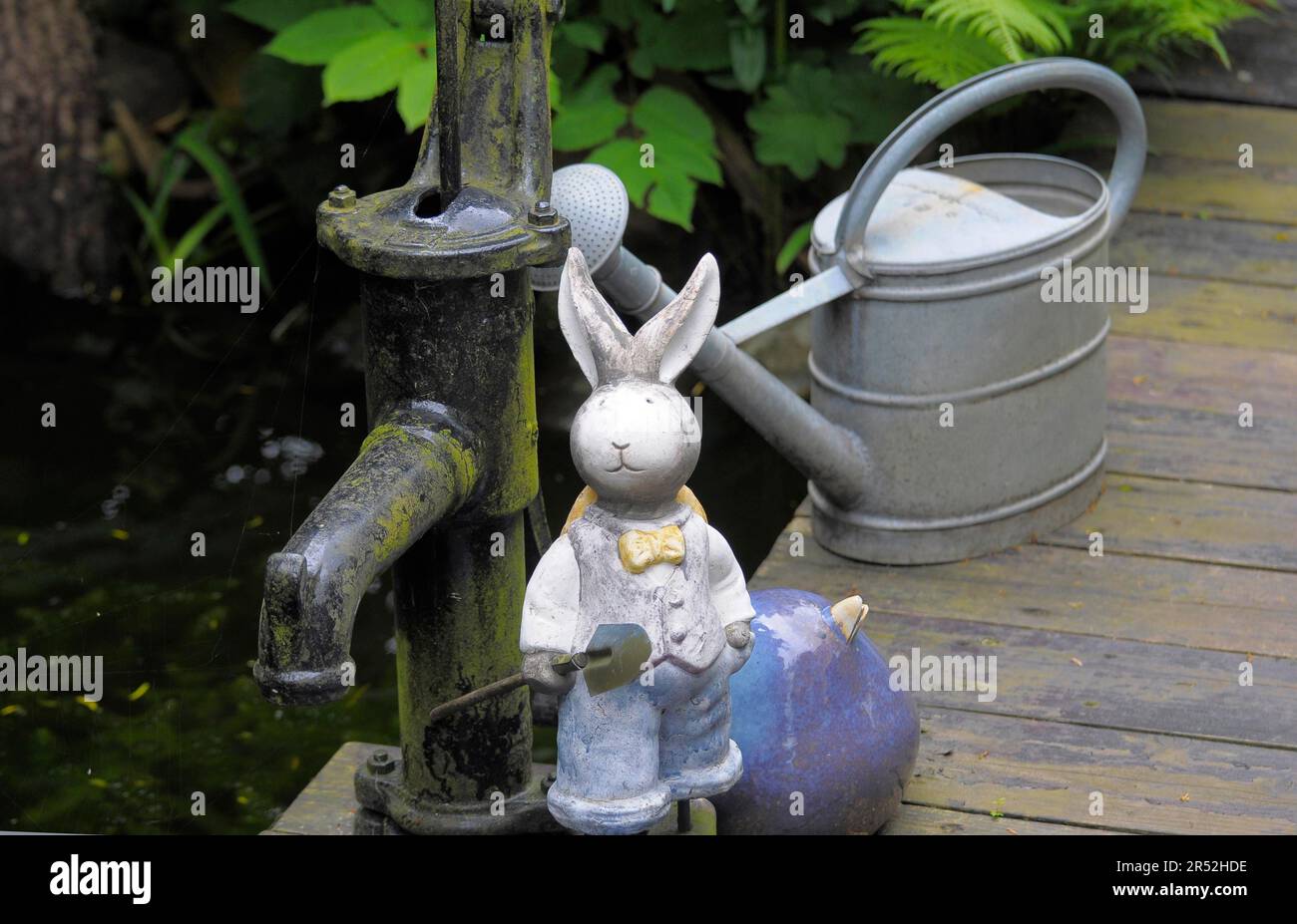 Rabbit figure by the garden, fountain Stock Photo - Alamy