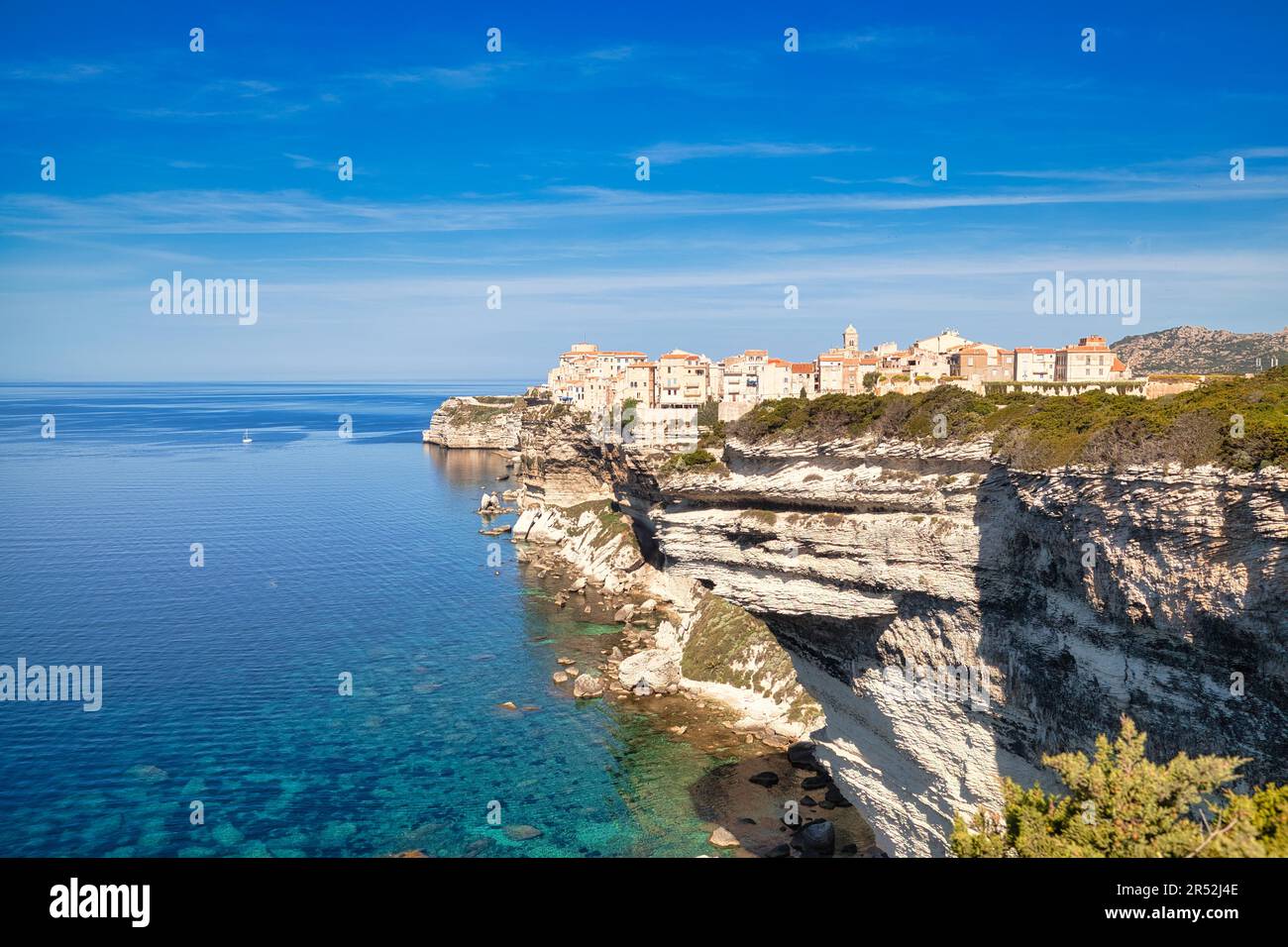 Steep coast of Bonifacio with old town on a limestone plateau ...
