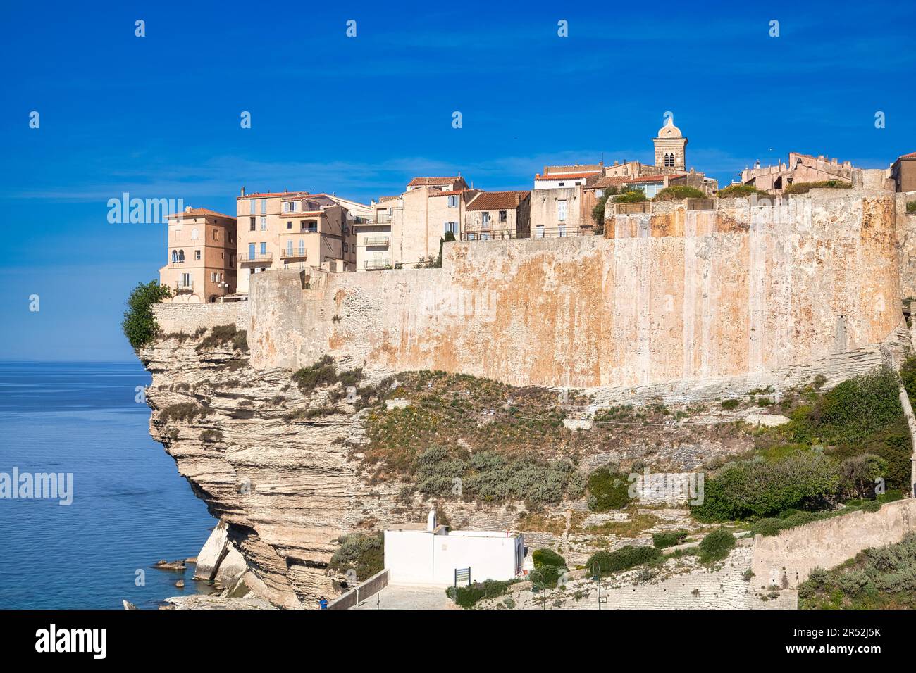 Steep coast of Bonifacio with old town on a limestone plateau ...