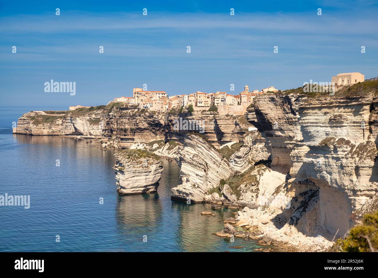 Steep coast of Bonifacio with old town on a limestone plateau ...