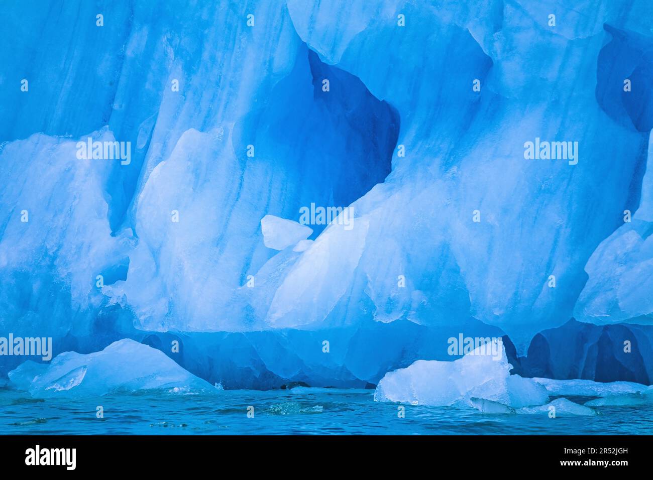 Ice cave at a t glacier in the arctic by the sea, Svalbard, Norway ...