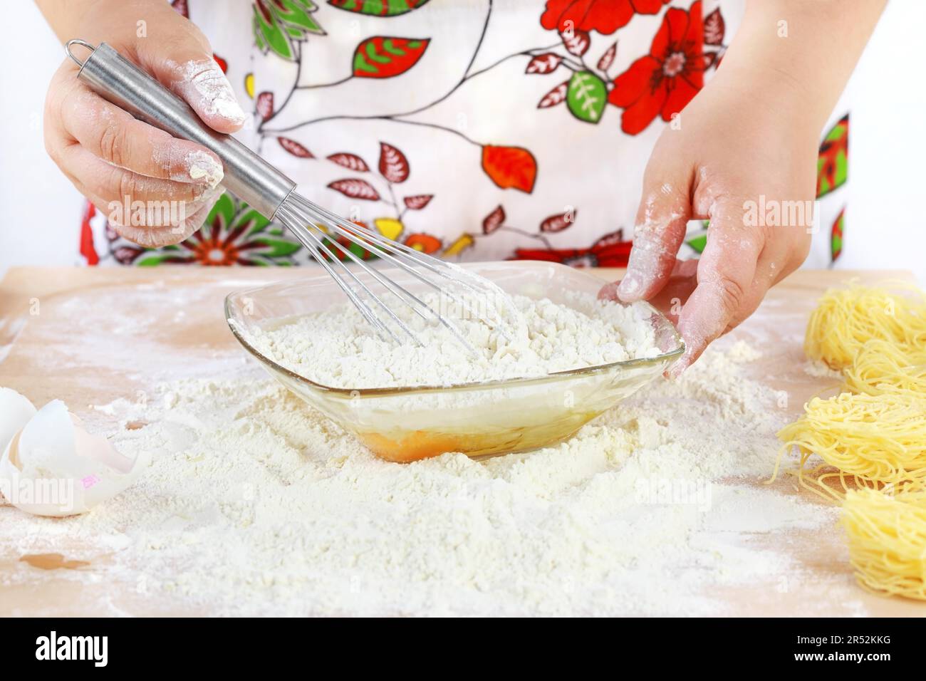 Details of womans hands mixing dough Stock Photo - Alamy