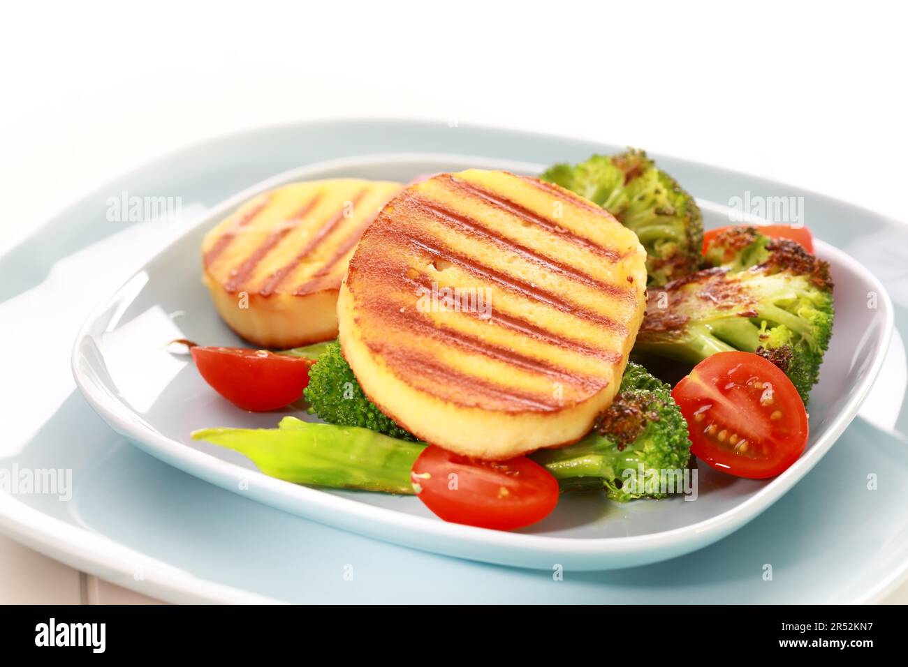 Grilled gouda cheese on grilled vegetables Stock Photo - Alamy