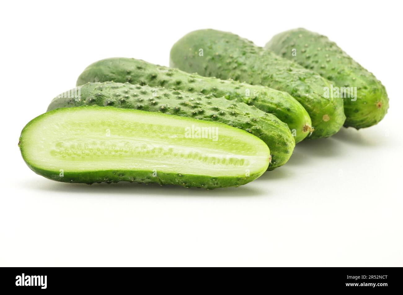 Fresh raw cucumbers isolated on white Stock Photo - Alamy