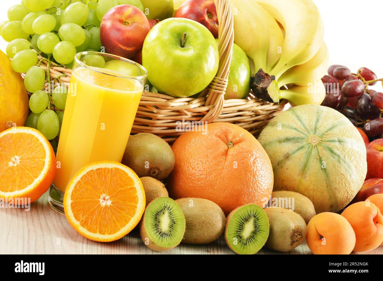 Composition with assorted fruits in wicker basket isolated on white ...