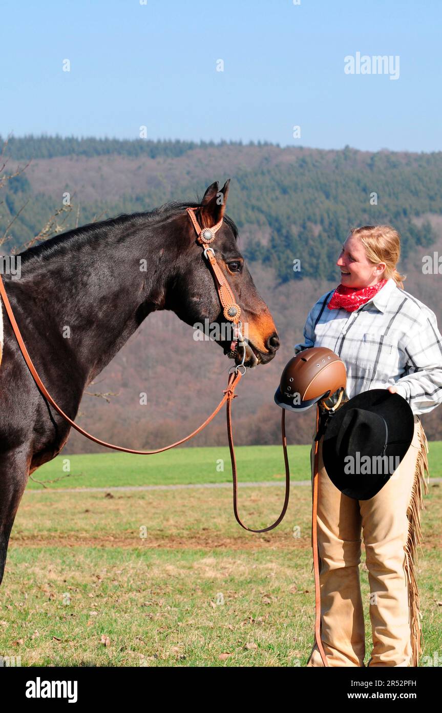 Woman with American Quarter Horse, stallion, western riding, crash ...