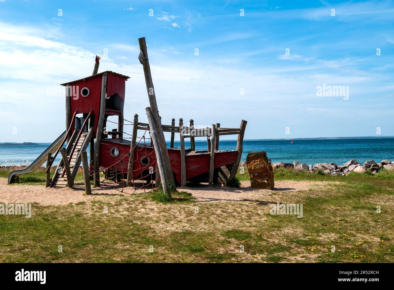 Climbing frame in the shape of a ship on a playground on the beach ...
