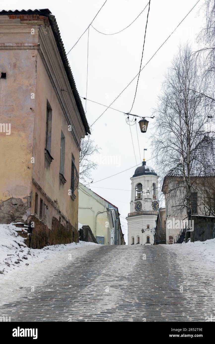 Old town of Vyborg, Russia, vertical street view with the old clock ...
