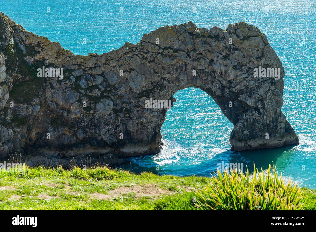 Durdle Door natural stone arch, Dorset, England, UK with sparkling blue ...