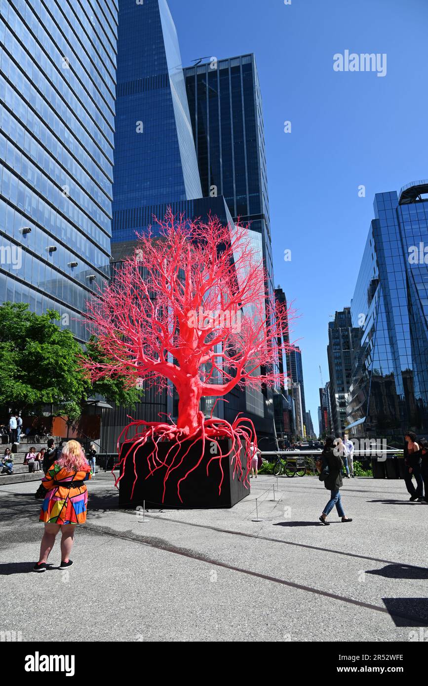 The pink "Old Tree" art installation rises above a plaza on the spur of ...