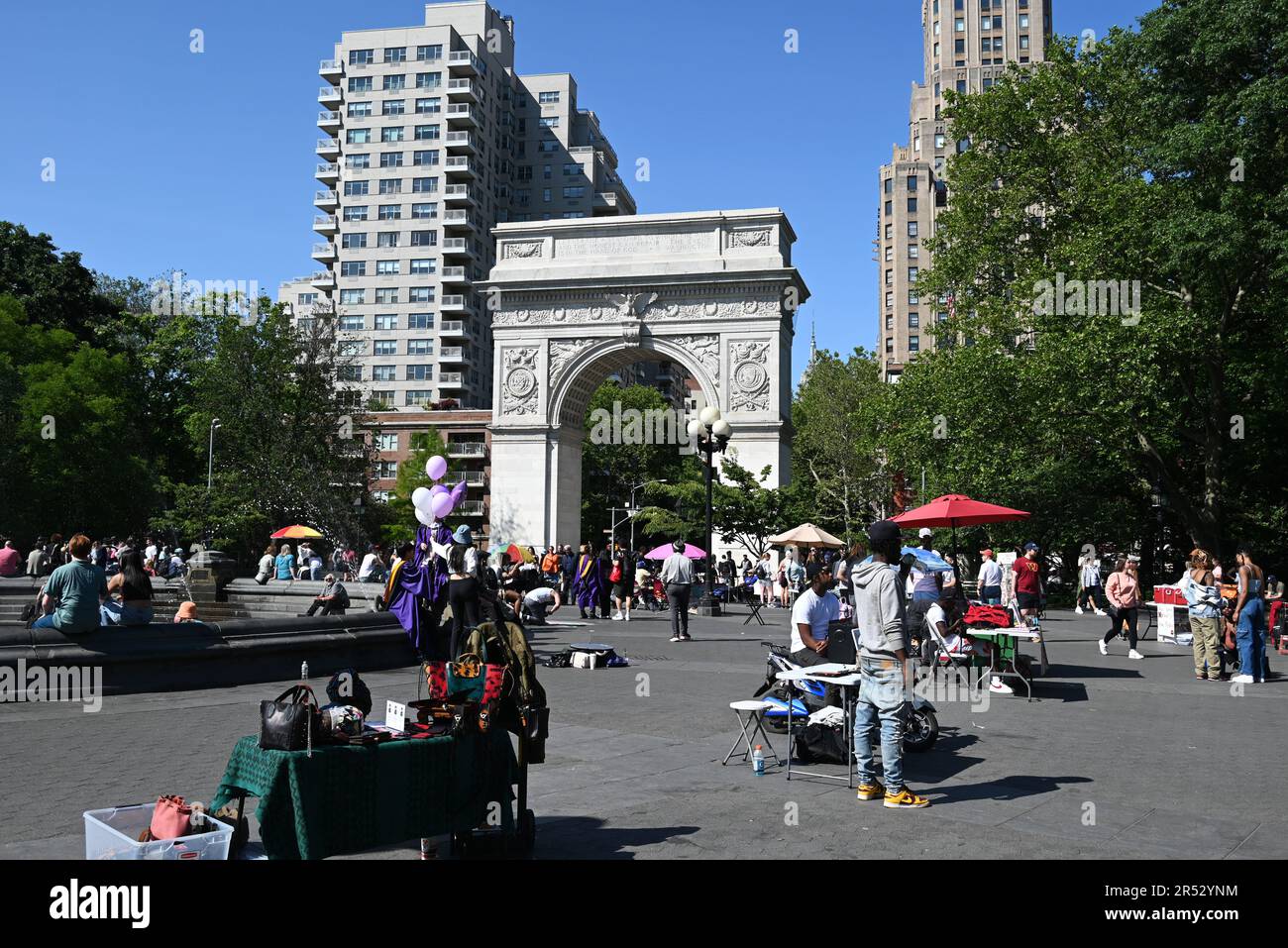 Vendors line the fountain plaza at Washington Square Park in New York's ...