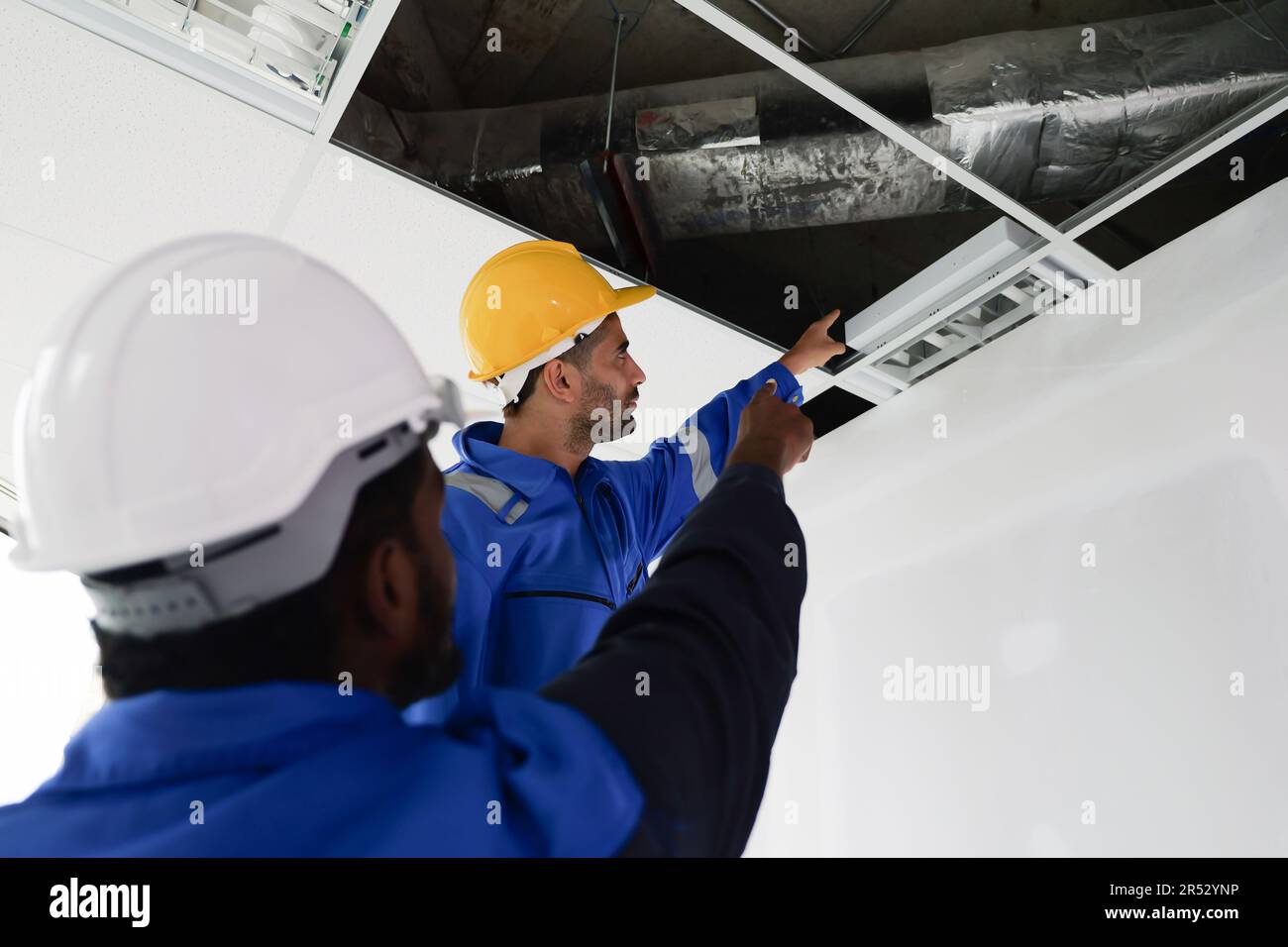Engineers working and installing system at construction site Stock ...
