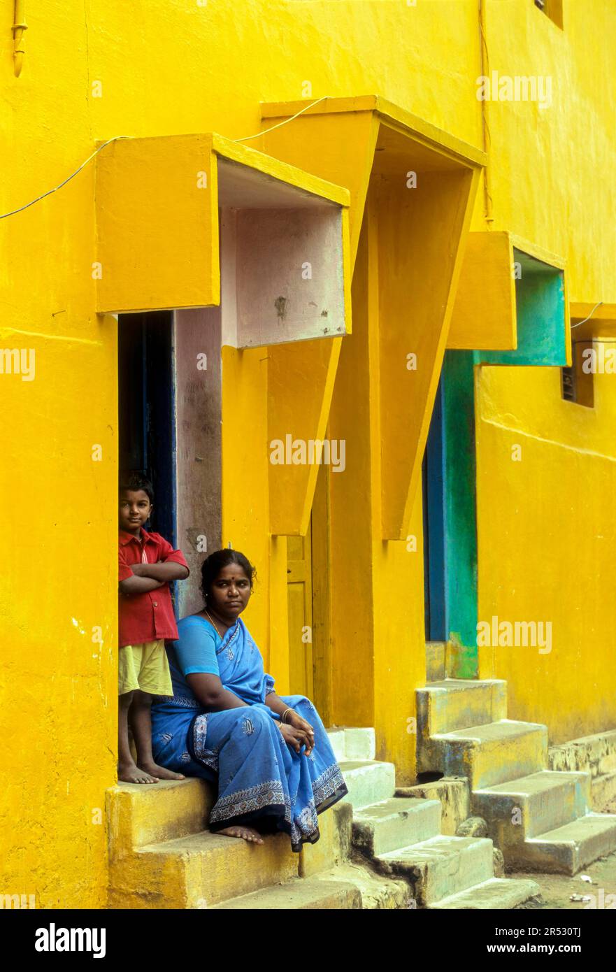 A mother and her son in front of their house at Courtalam Kutralam ...