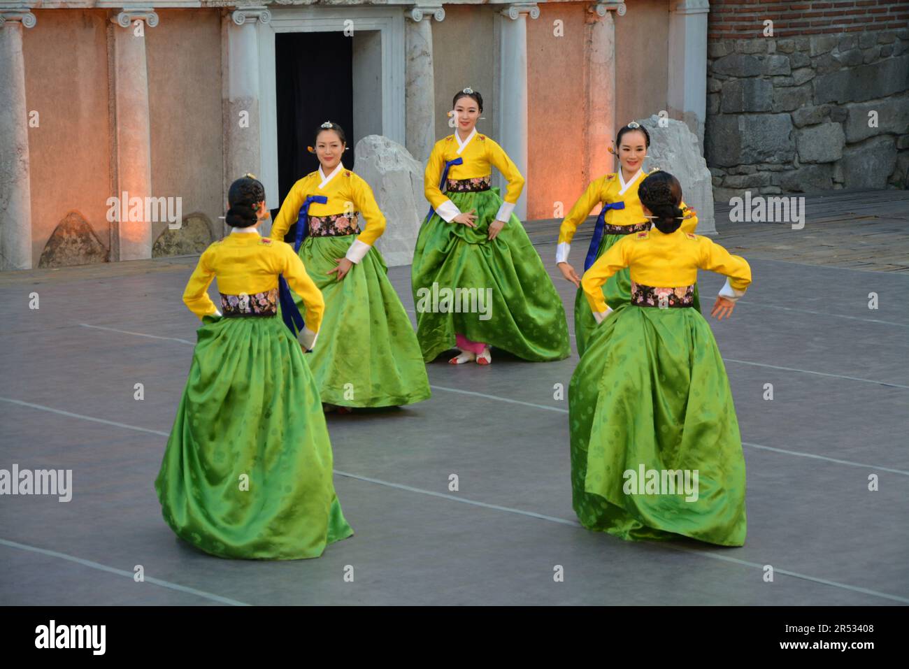 A group of women from the Republic of Korea in colorful costumes ...