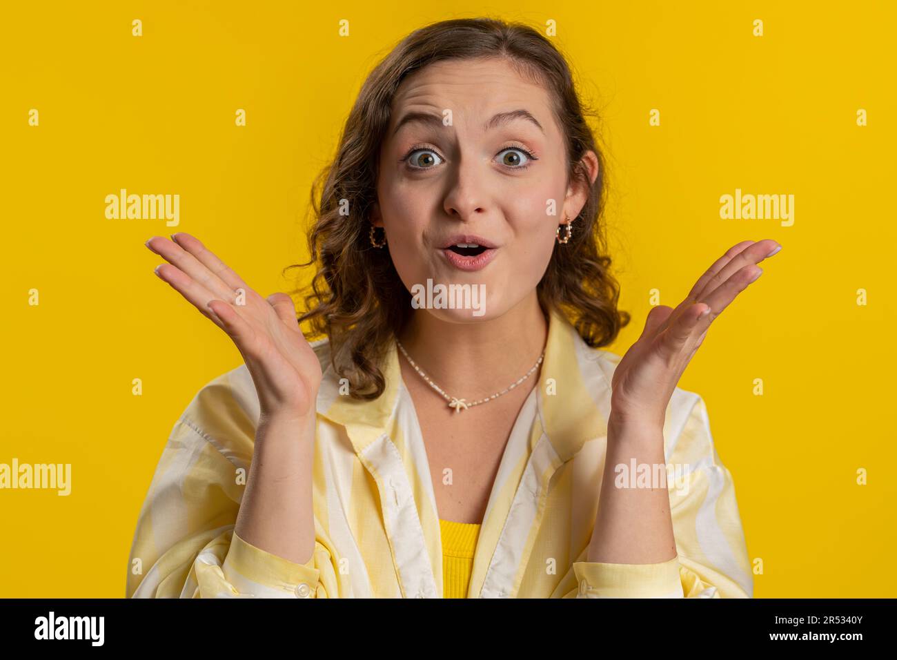 Oh my God, Wow. Excited amazed winner woman raising hands in surprise ...