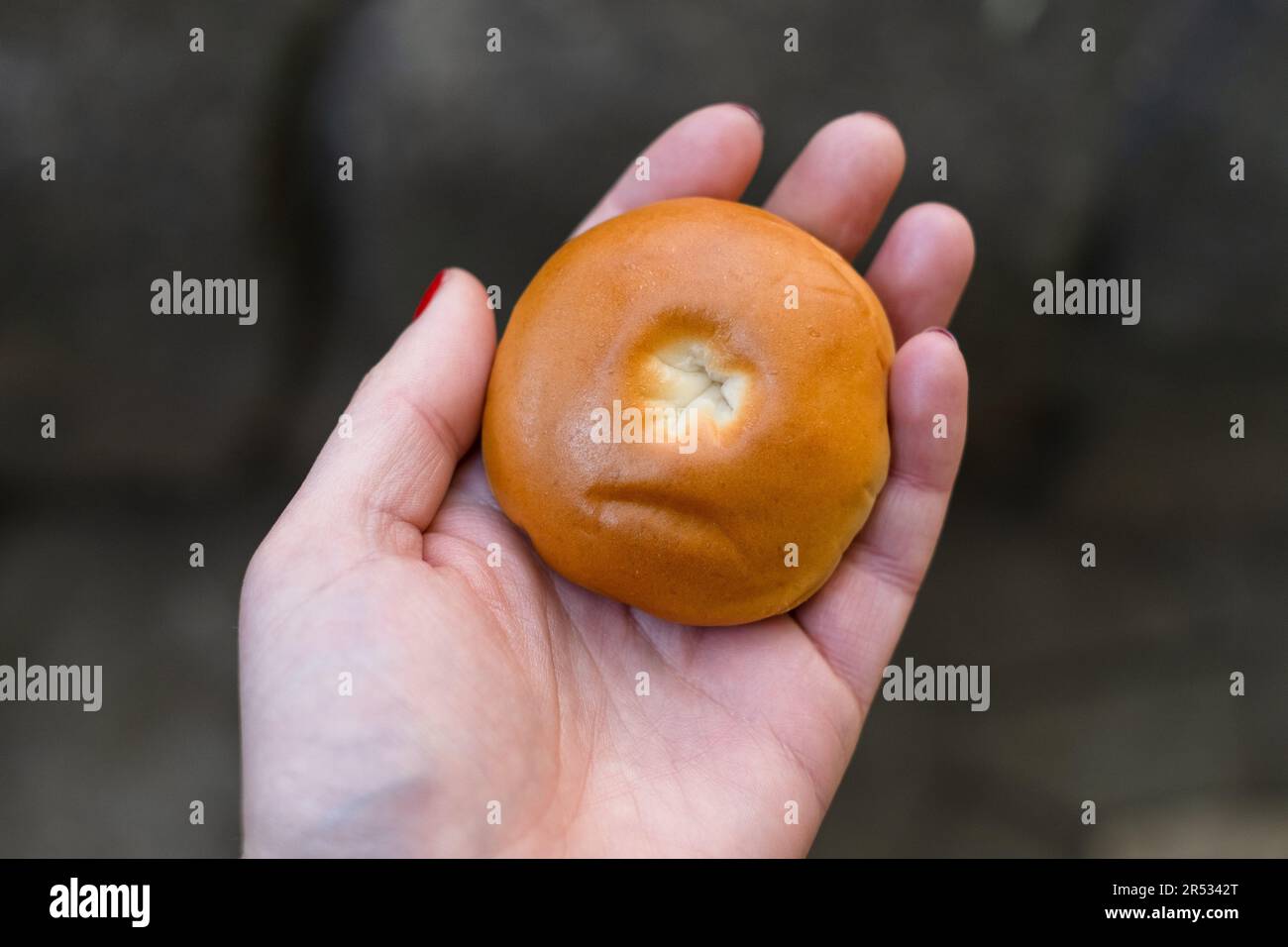 Hand holding a red bean paste bun from a convenience store, Tokyo ...