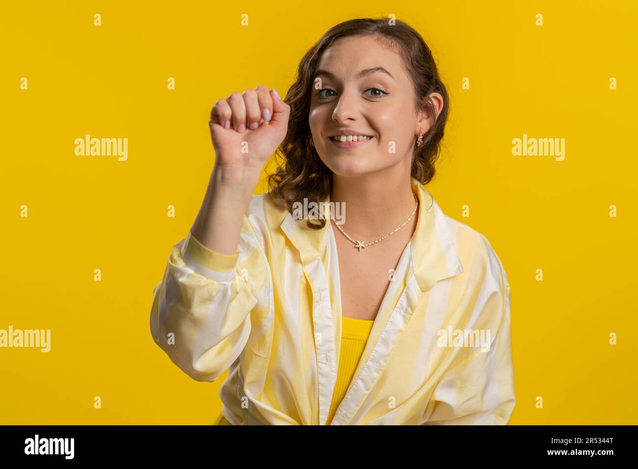 Knock-knock who is there. Excited young woman knocking door gesture ...