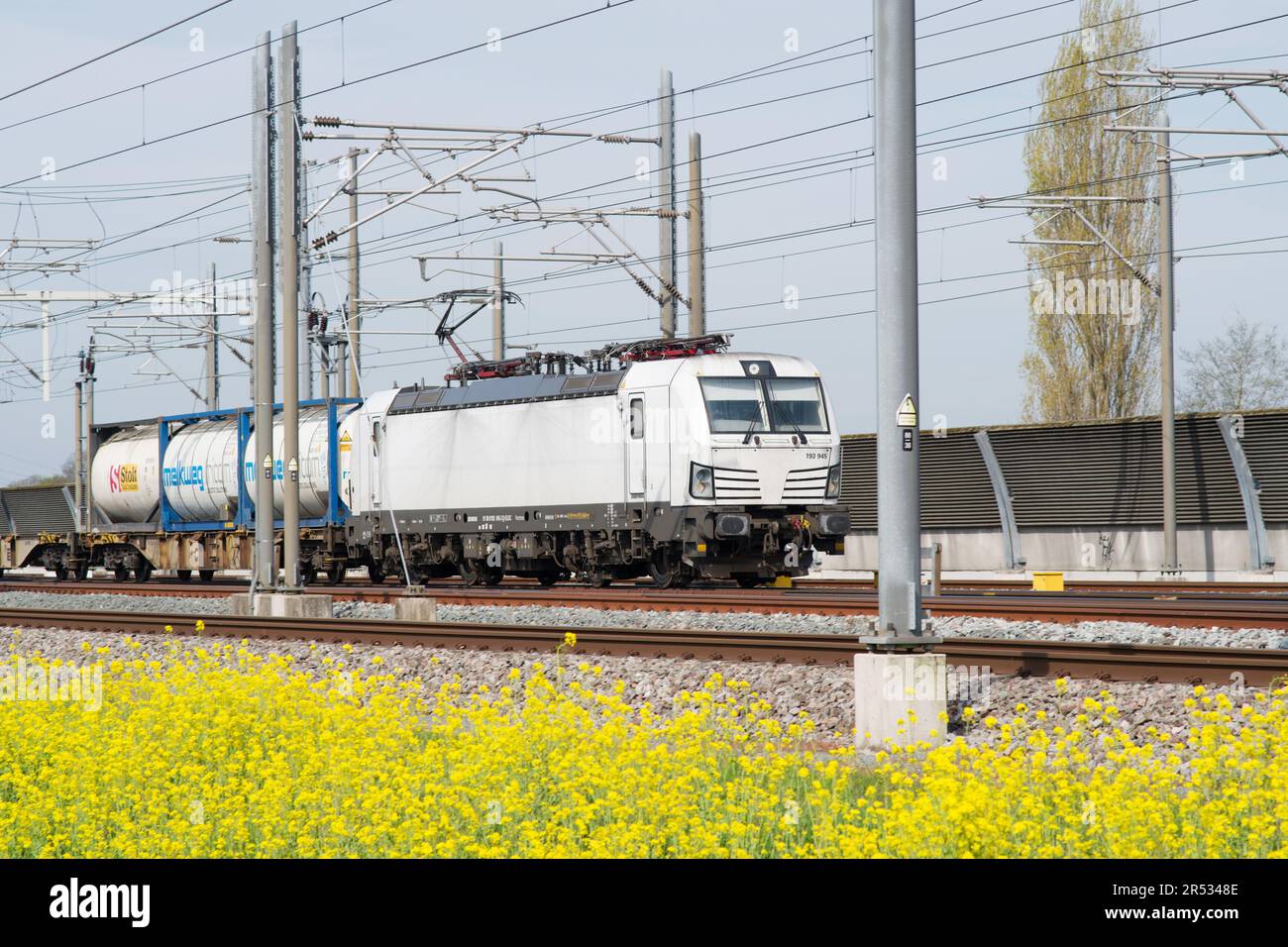Elst, Netherlands - April 22, 2023: Grey locomotive with freight wagons ...