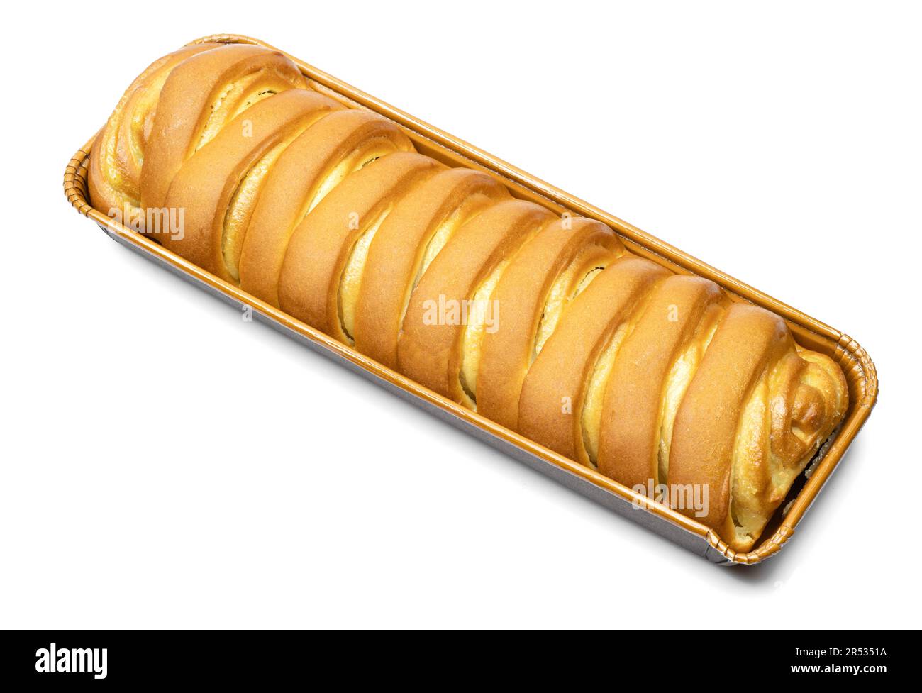 Dessert swirled golden color pastry roll filled in styrofoam pack ...