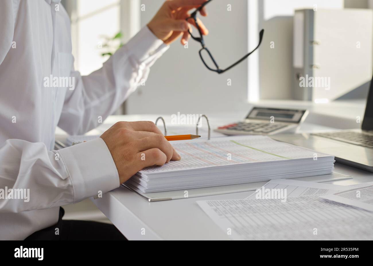 Close-up photo of businessman anaccountant working with documents with ...