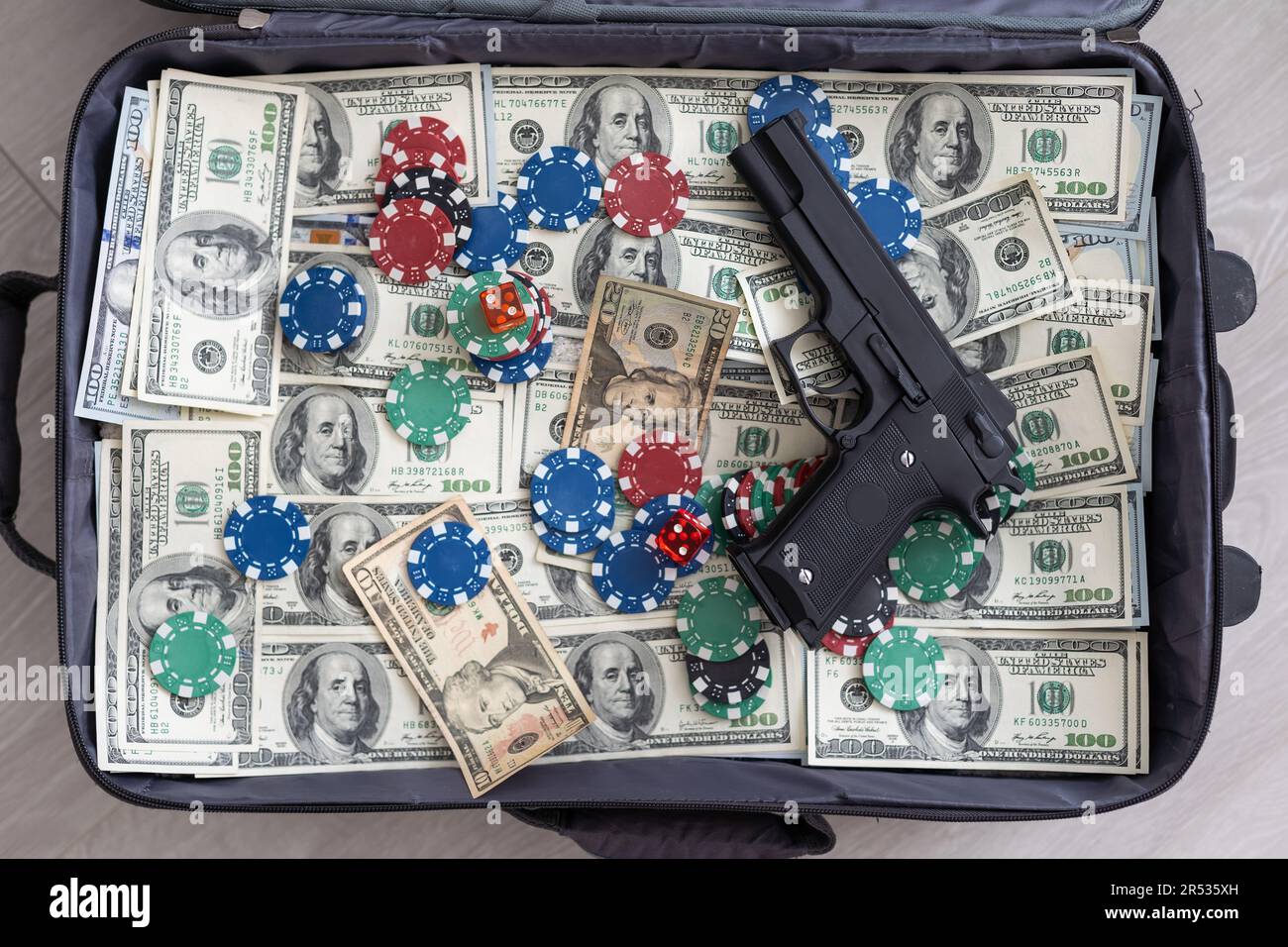 Suitcase with pile of dollars. Opened silver case with money. Better to ...