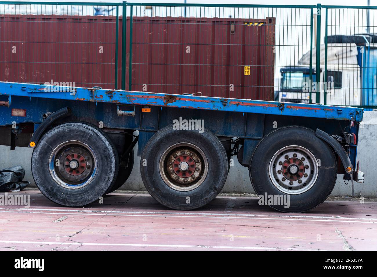 Empty container trailer parked in a loading dock at the port of ...