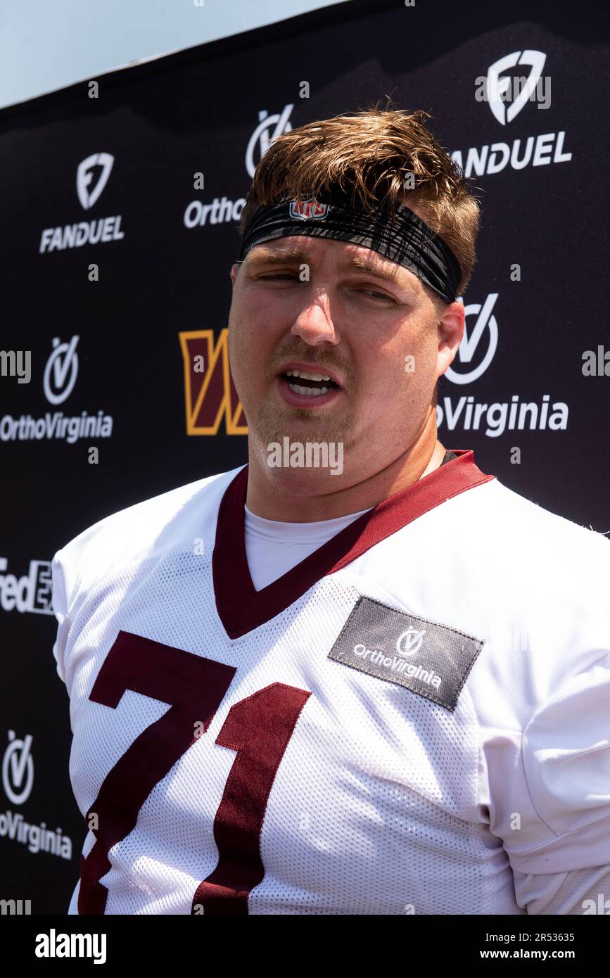 Washington Commanders guard Andrew Wylie speaks with reporters ...