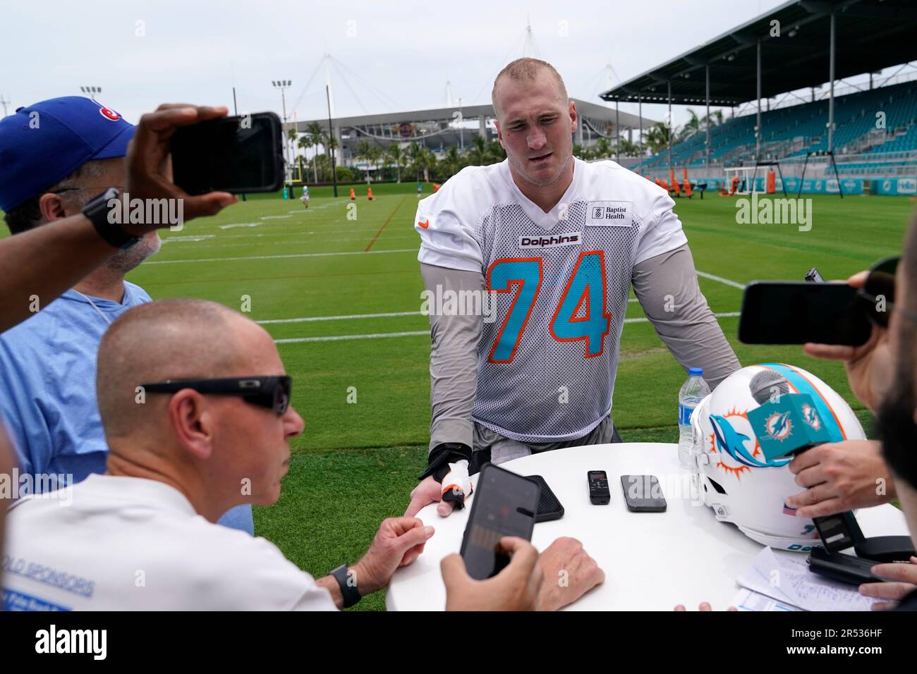 Miami Dolphins offensive tackle Liam Eichenberg (74) talks with the ...