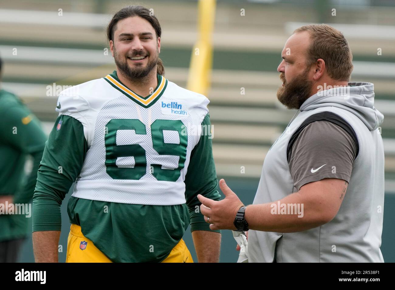 Green Bay Packers' David Bakhtiari talks to coach Luke Butkus during an ...