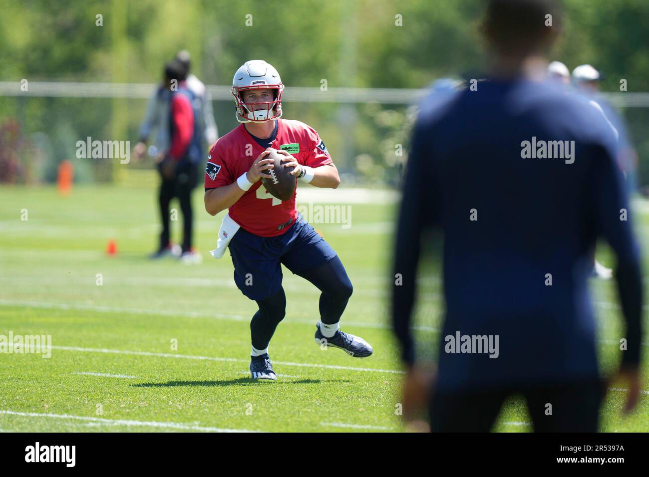 New England Patriots quarterback Bailey Zappe, center, performs field ...