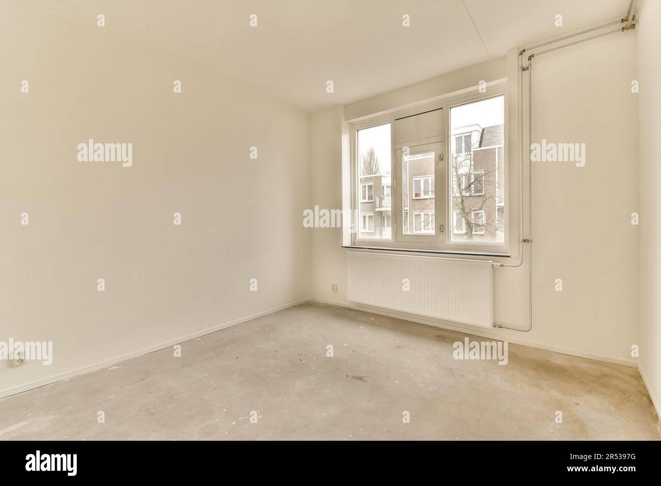 an empty room with white walls and no one window in the photo is taken ...