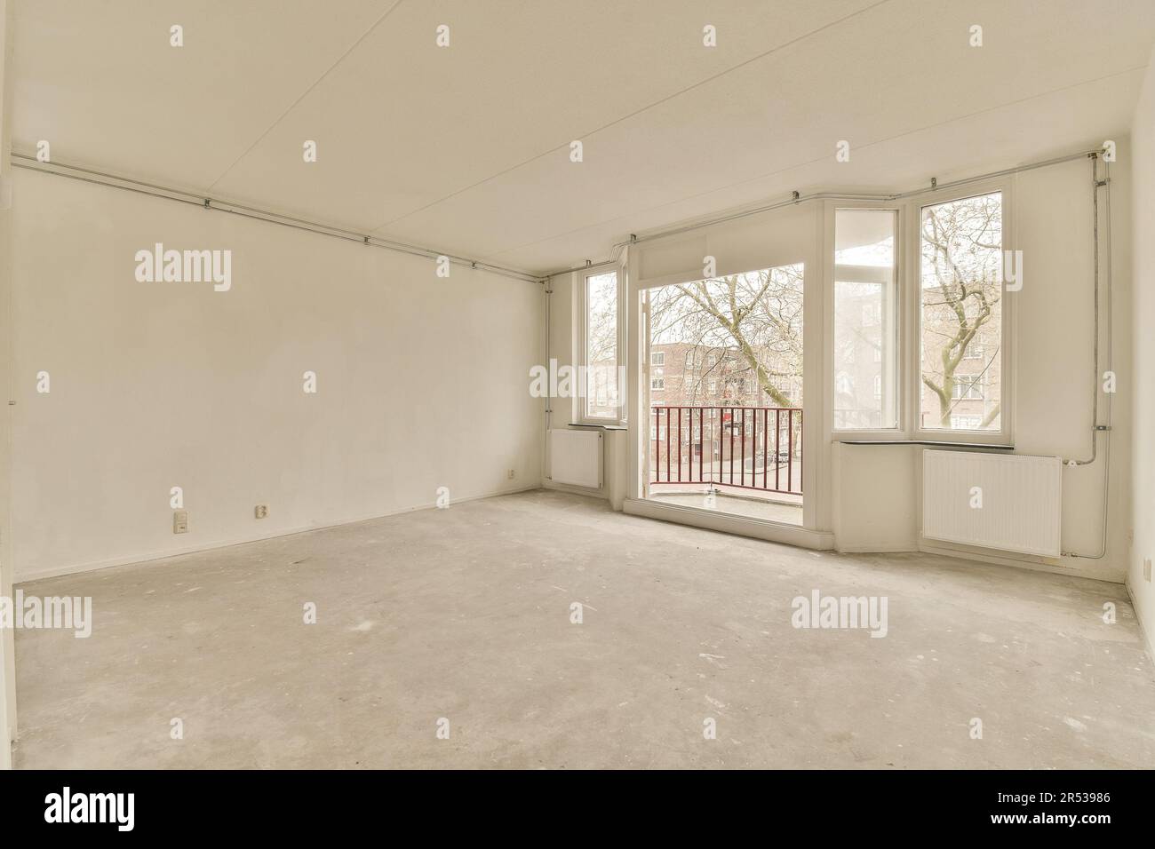 an empty room with white walls and no one person standing in the corner ...