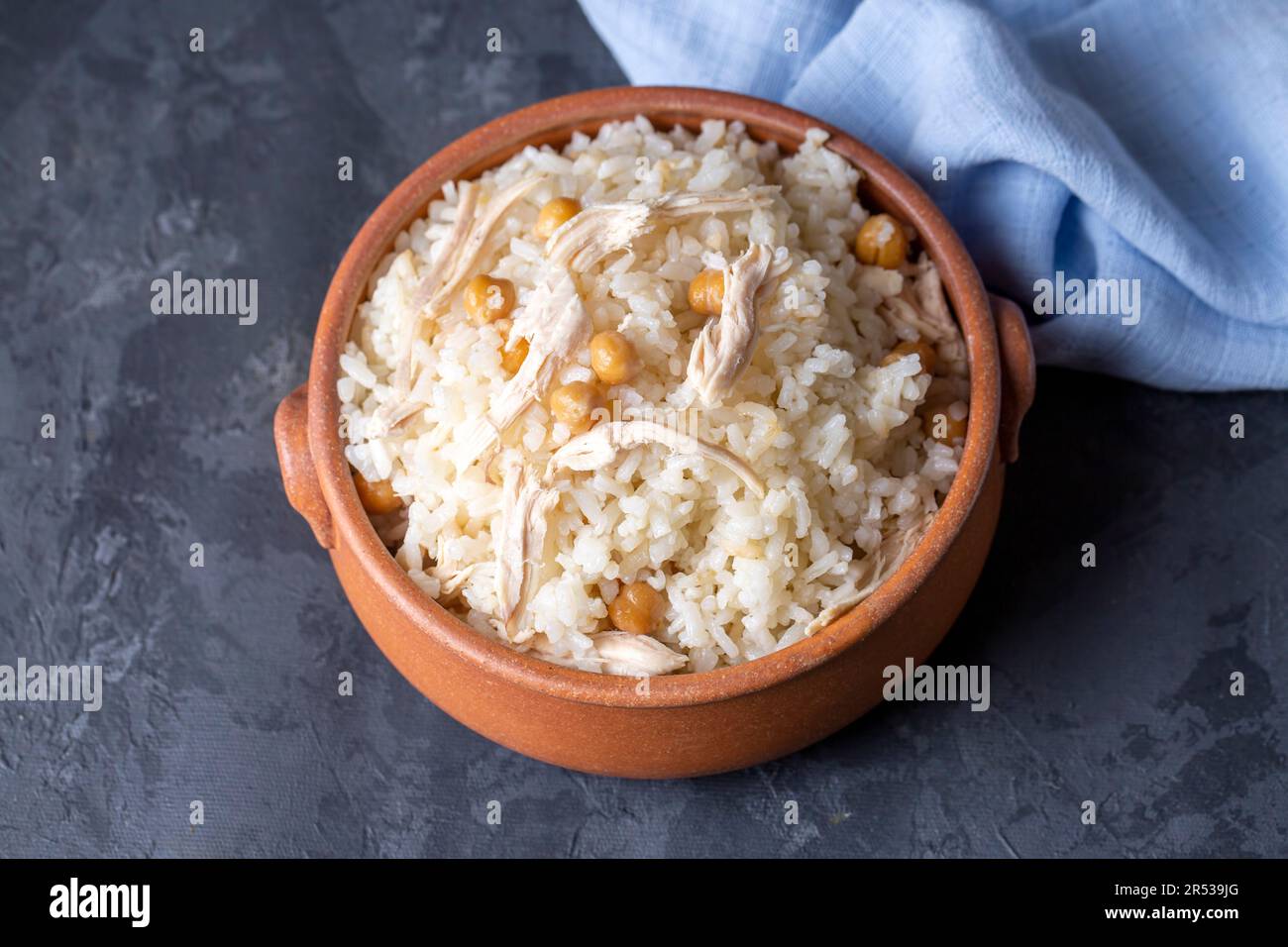 Traditional delicious Turkish food; Rice with chickpeas and chicken ...