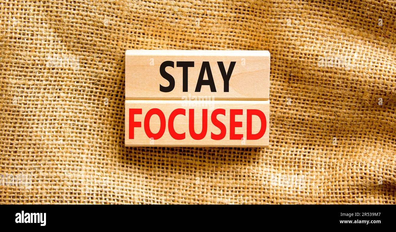 Stay focused symbol. Concept words Stay focused on wooden blocks on a ...