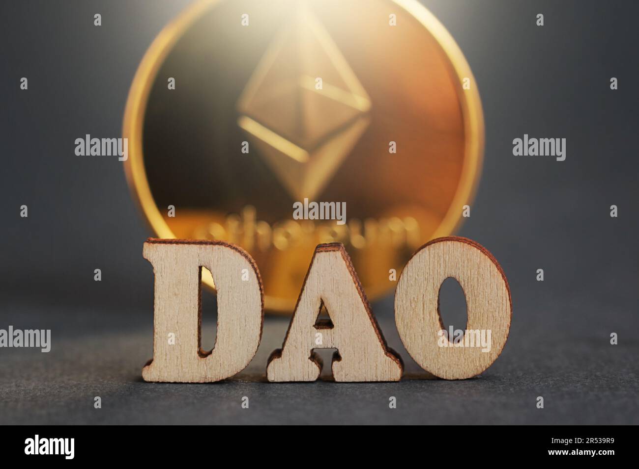 DAO. Decentralized Autonomous Organization. Letter DAO, gold coin ...